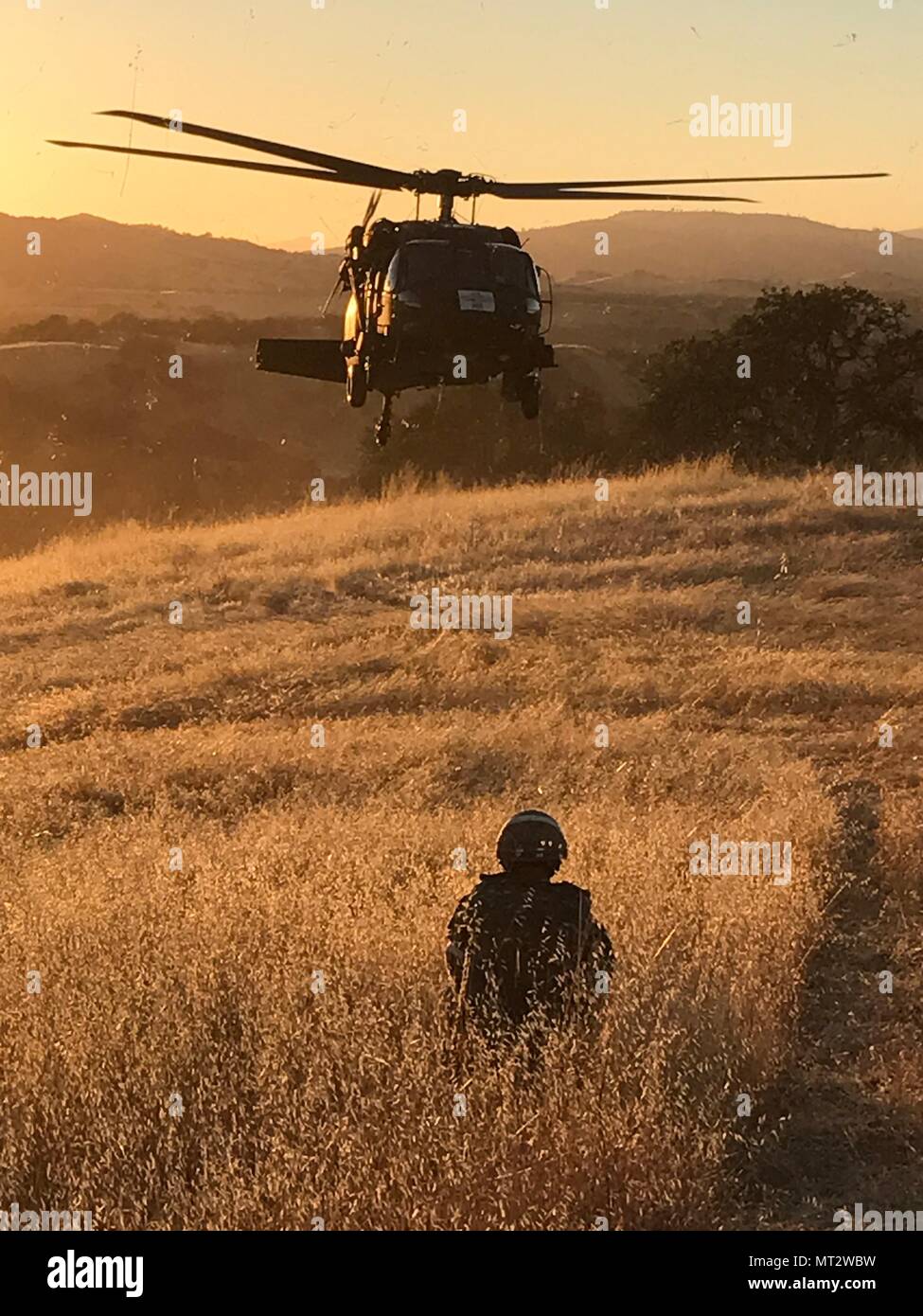 A Cal Guard medevac helicopter lands on a hill at Camp Roberts in June ...