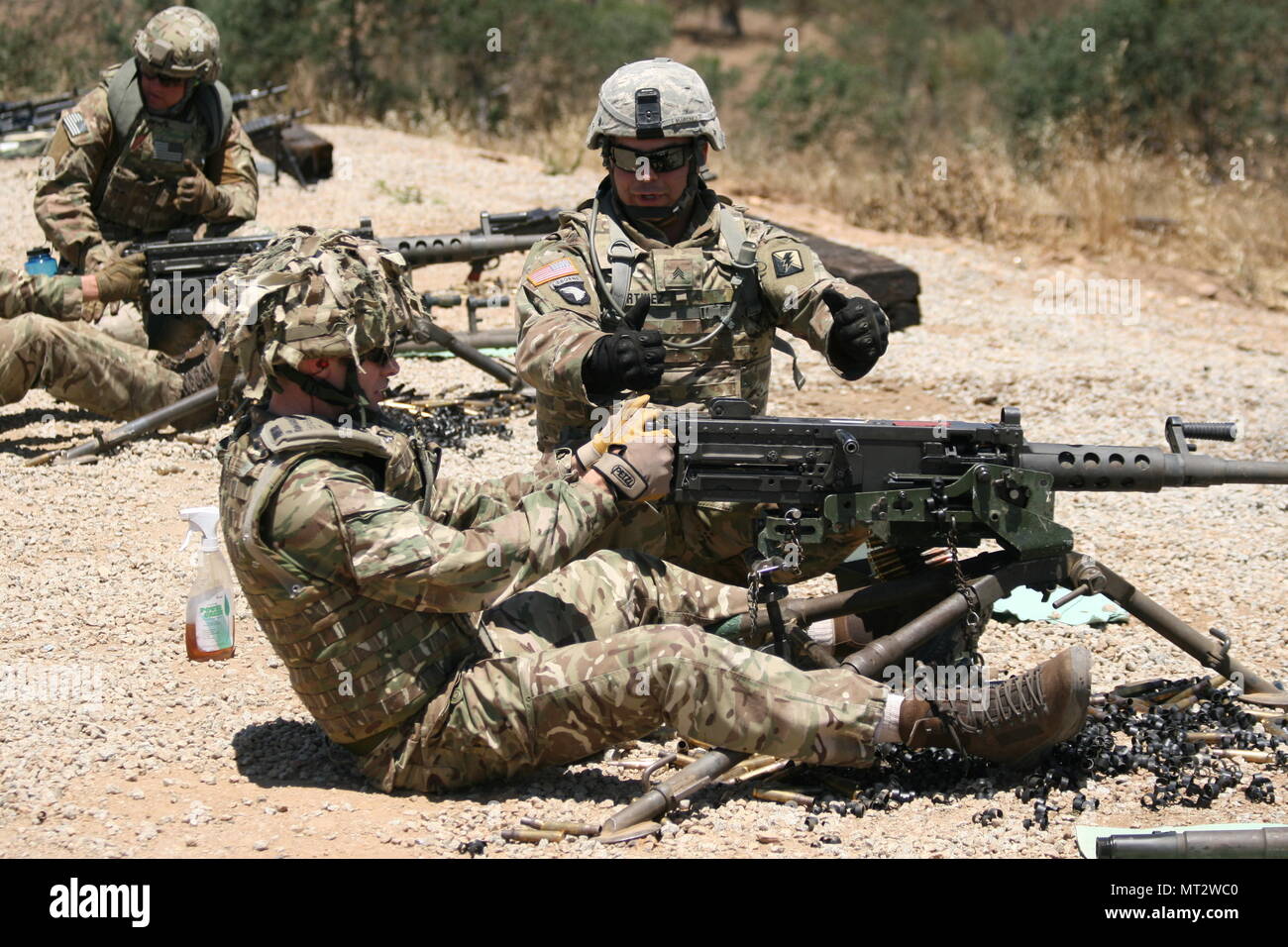 An American Soldier instructs a British Soldier on firing a .50-cal ...