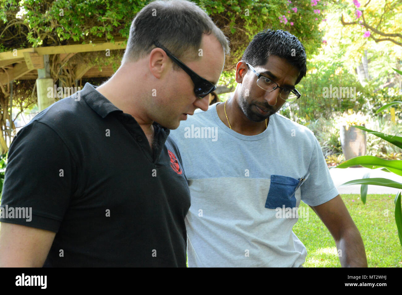 Participants of the Health Emergencies in Large Populations (H.E.L.P.) course gather information ...
