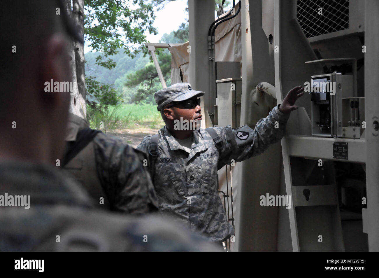 Sgt. 1st Class Luis Burgos, a mortuary affairs collection point NCOIC ...
