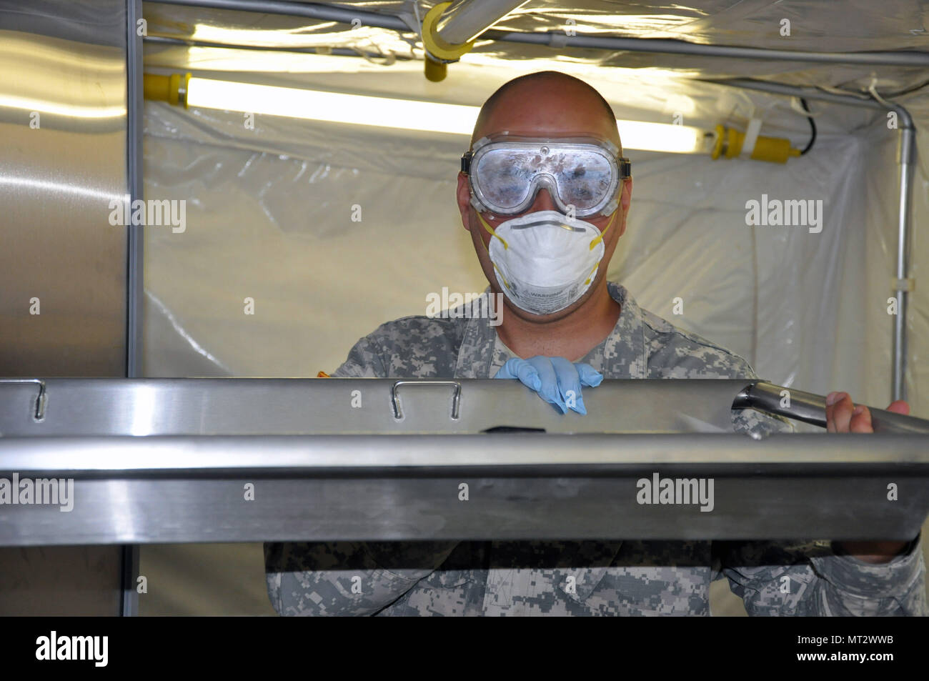 Spc. Christopher Myers, a mortuary affairs specialist with the 311th ...