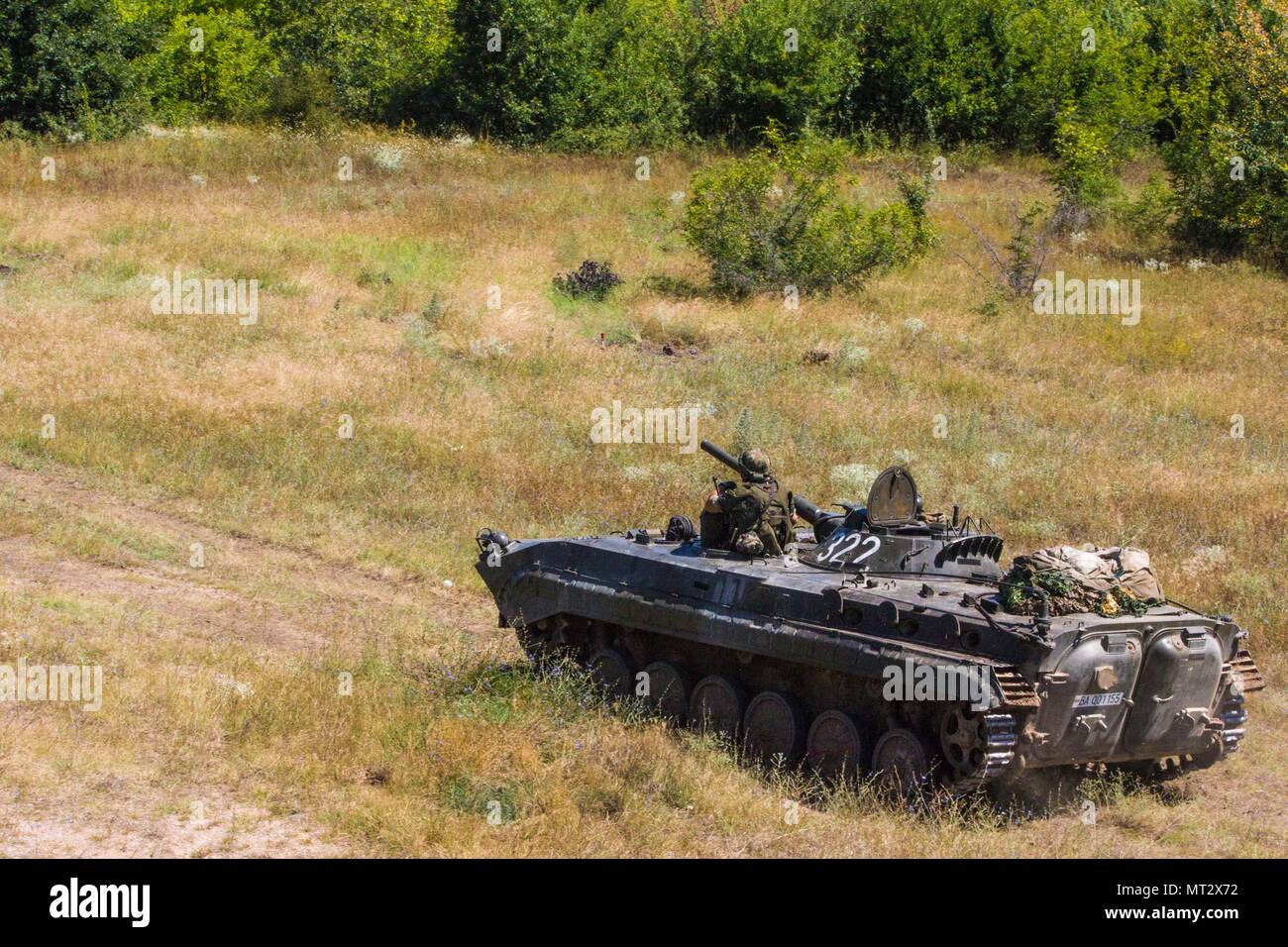 A Bulgarian Land Forces tank moves to an objective during a combined ...