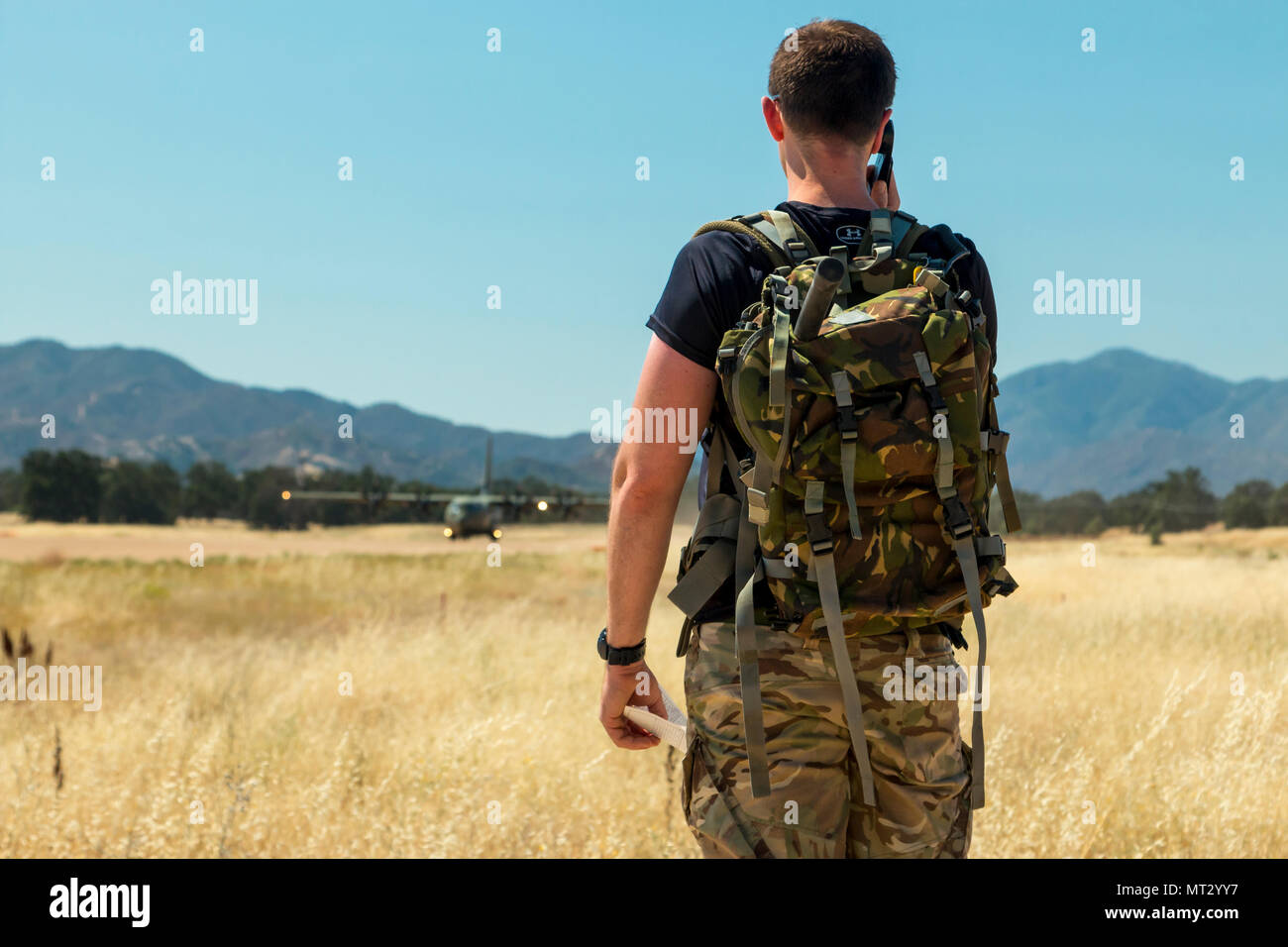 Jamie Graham, a British Tactical Air Traffic Controller, assists in the ...