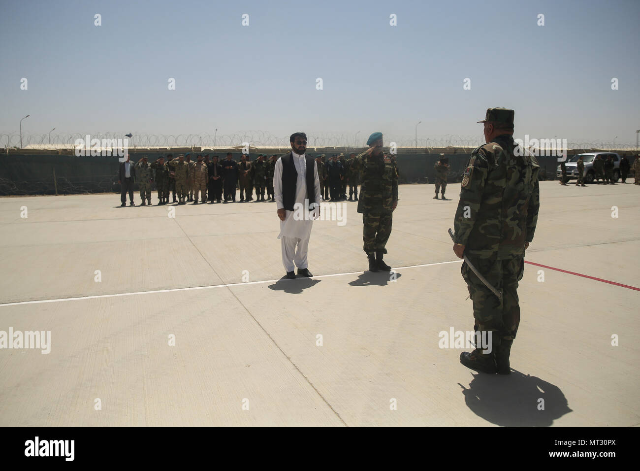 Hayatullah Hayat, center-left, the governor of Helmand Province, and ...