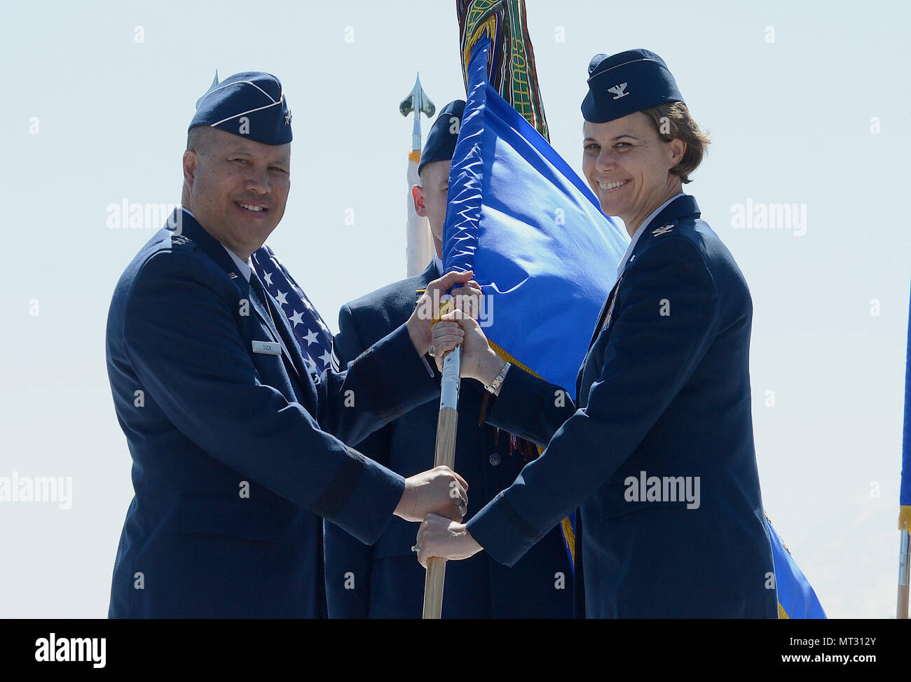 Col. Rebecca Sonkiss (right), 62nd Airlift Wing commander, accepts the ...