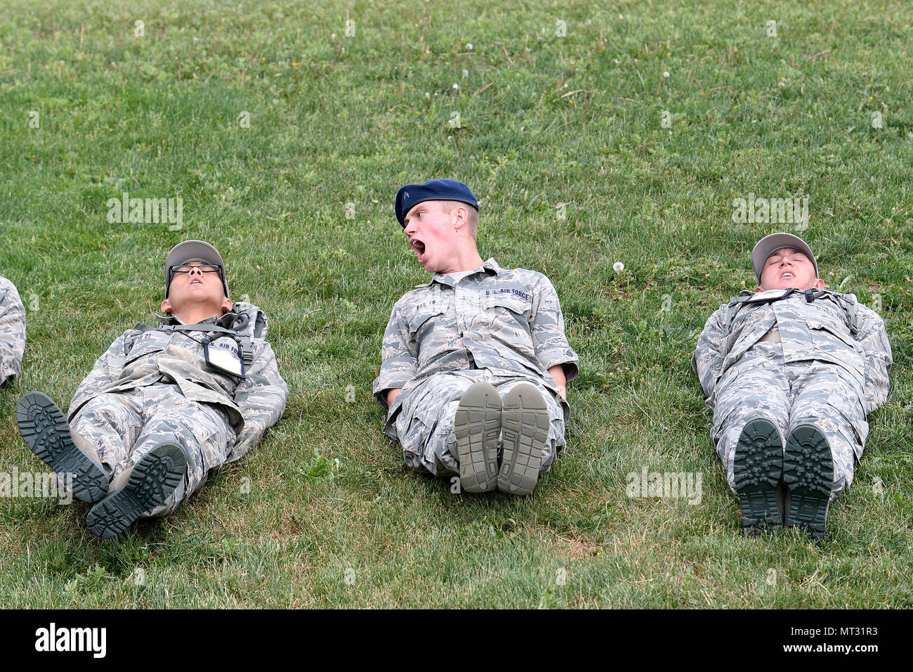 Cadet cadre member Liam Sax, a junior, encourages basic cadet Nathanael ...