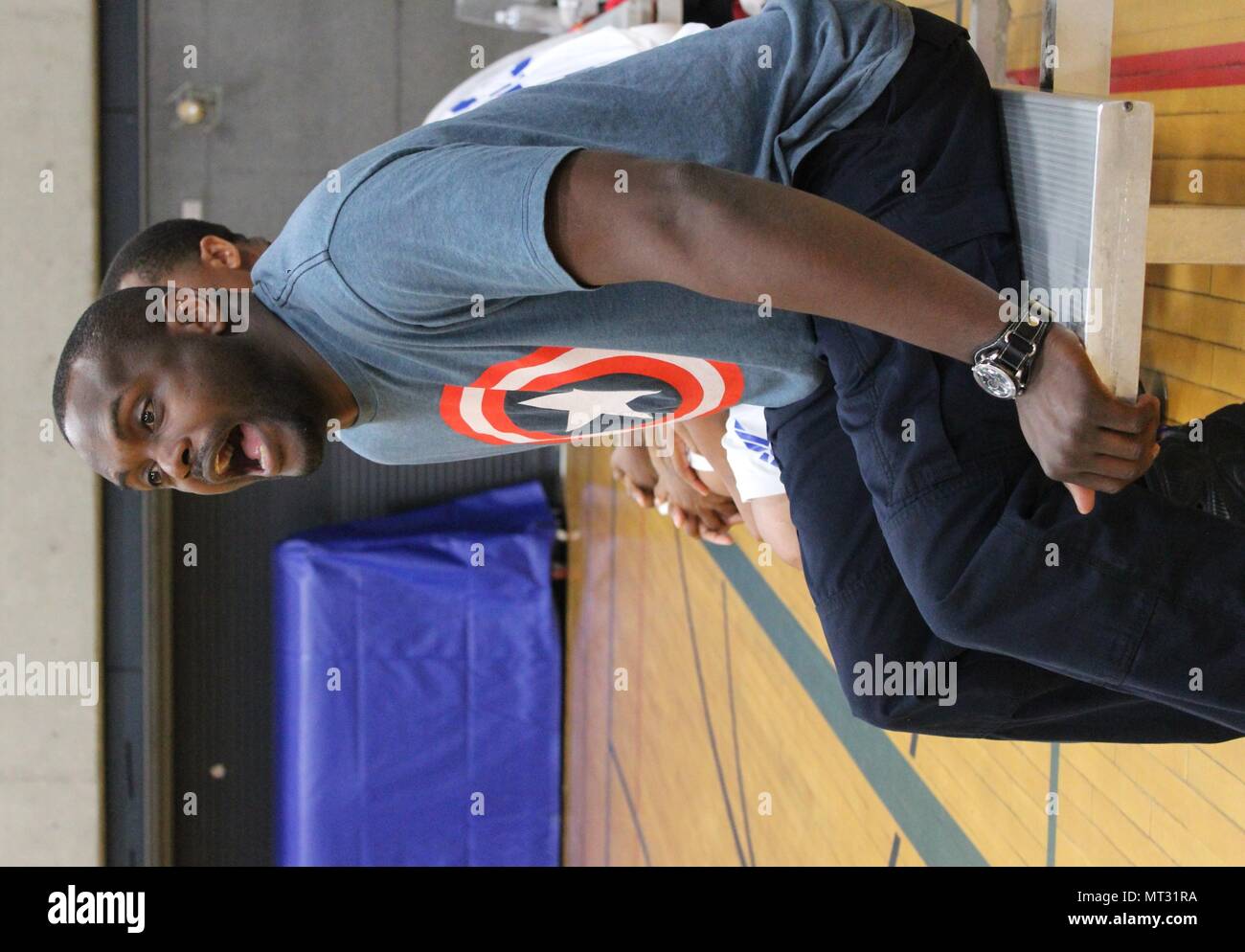 Air Force coach and family member Joshua Hancock shouts encouragement ...