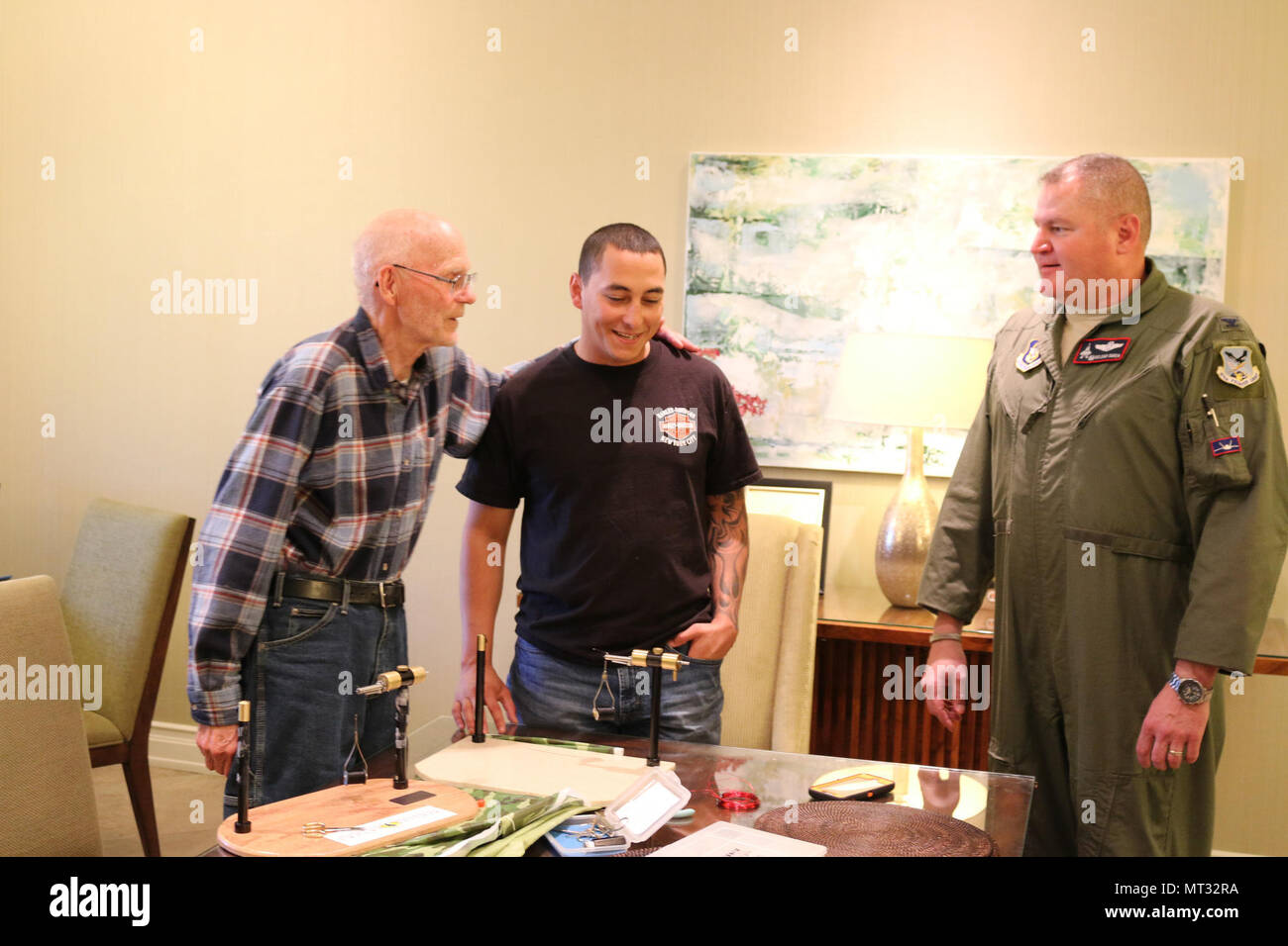 Col. Christopher Ogren, 477th Fighter Group Commander, talks with ...