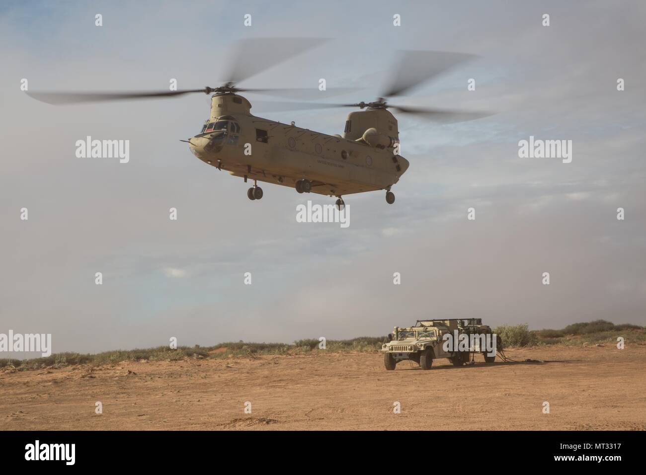 CH-47 Chinook prepares to transport a HUMVEE during a sling load operation during the Network ...