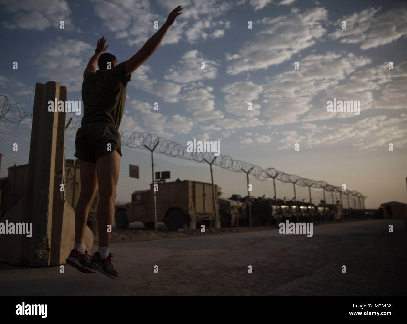 A U.S. Marine advisor with Task Force Southwest performs a burpee ...
