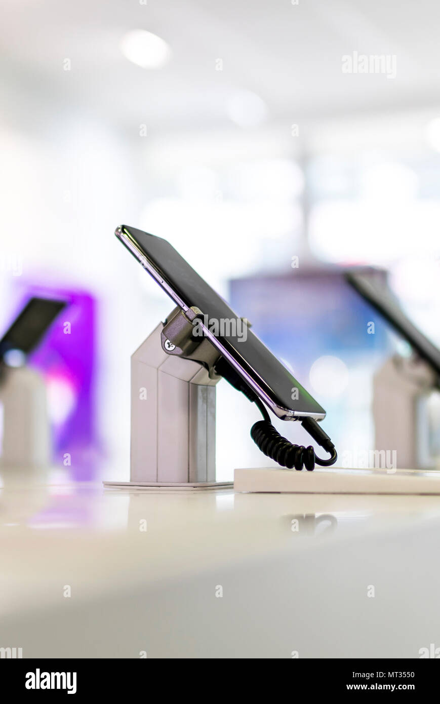 Close up of cell phones or mobile phones on display in a modern, clean ...