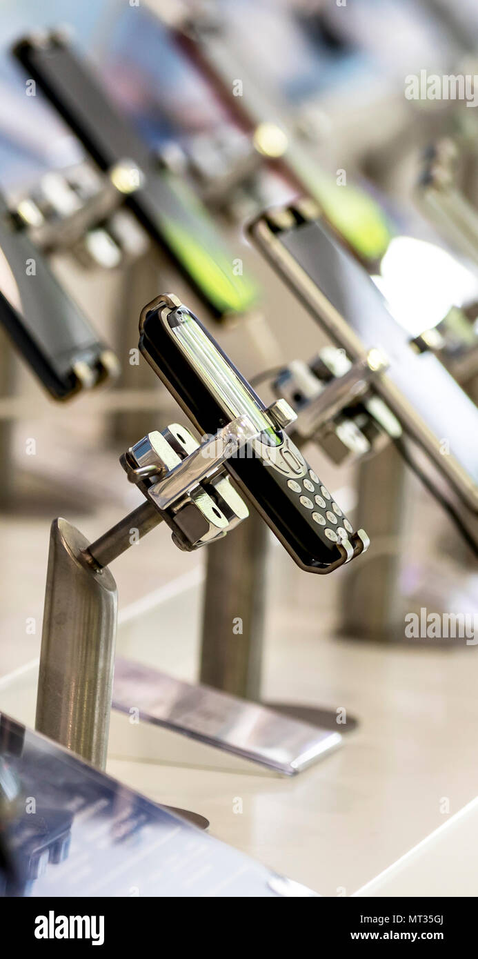 Close up of cell phones or mobile phones on display in a modern, clean ...