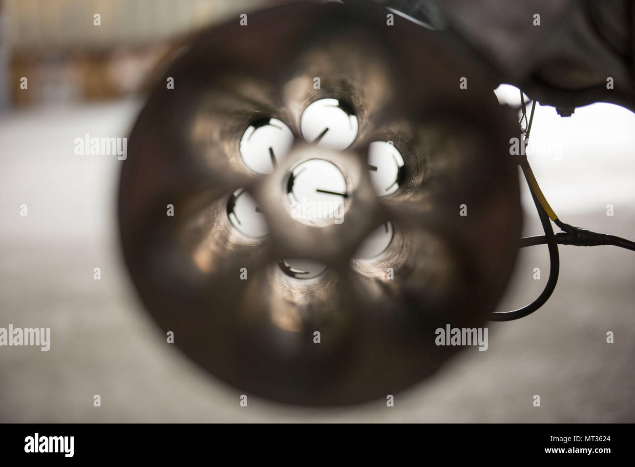 A 70mm Hydra rocket pod attached to an AH-1W Super Cobra helicopter is ...