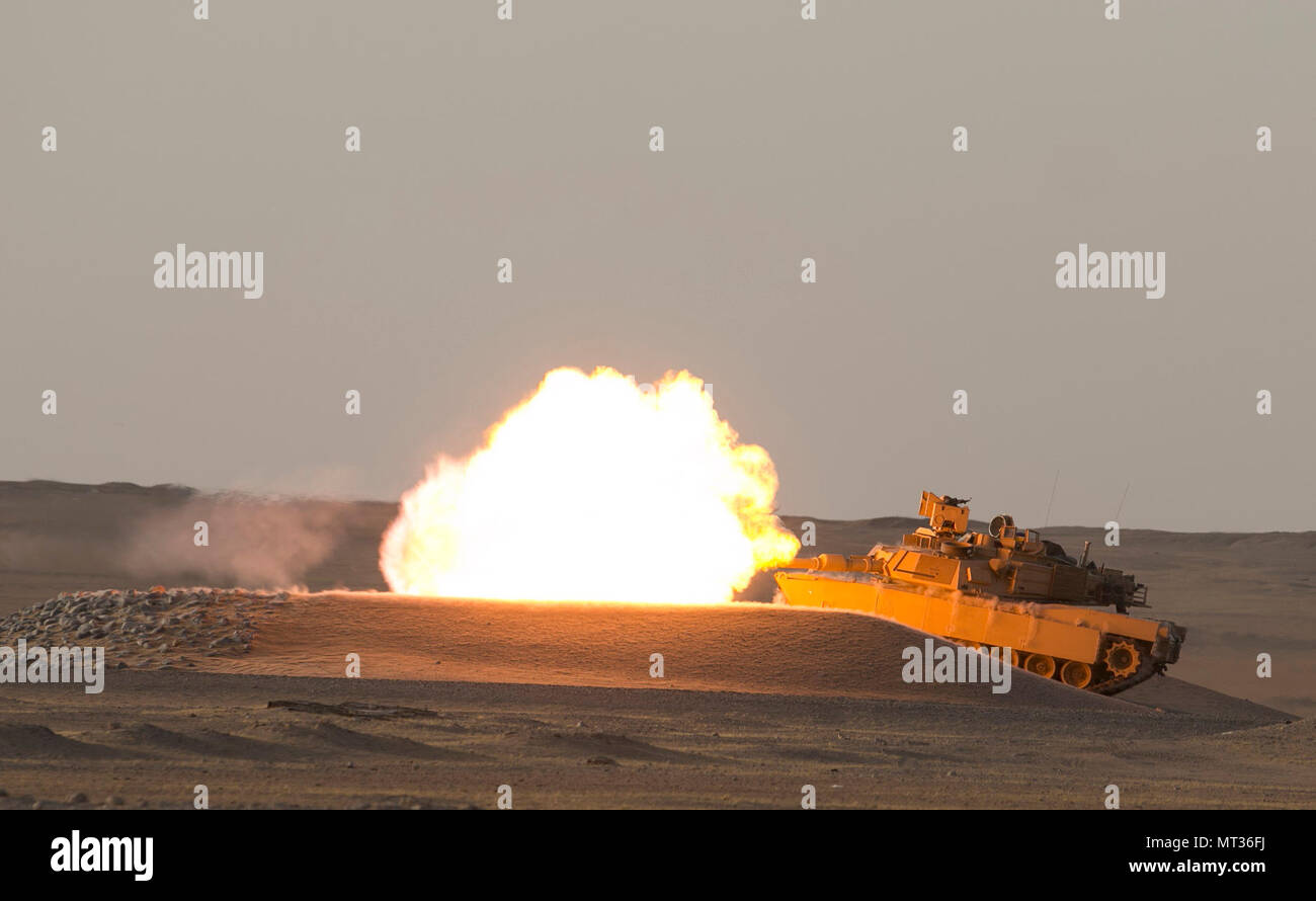 An M1A2 Abrams Main Battle Tank crew engages targets while providing ...