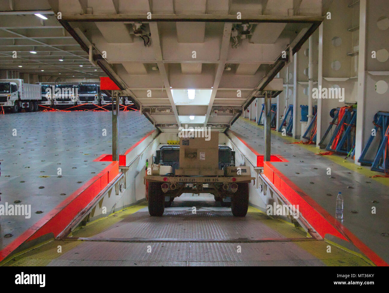 A US Army Humvee carrying a tactical quiet generator drives into the ...
