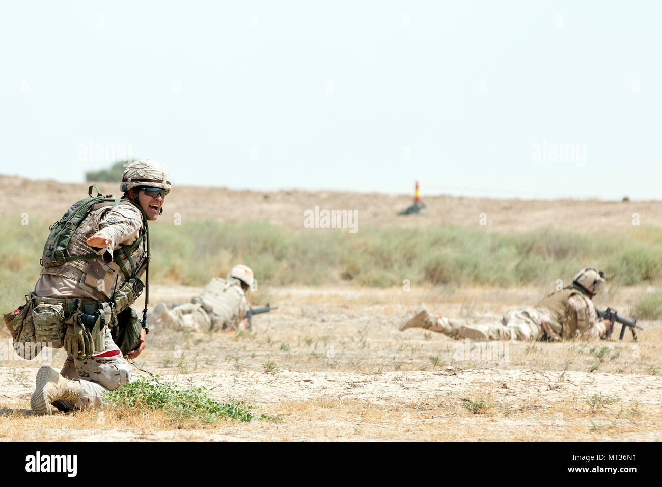 A Spanish army trainer gives instruction to Iraqi army soldiers during ...