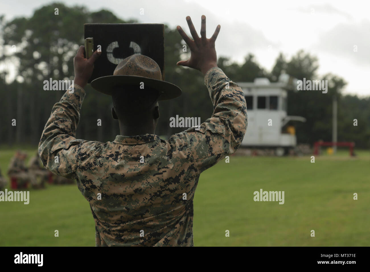 U.S. Marine Corps Sgt. Derrick Watson, primary marksmanship instructor ...