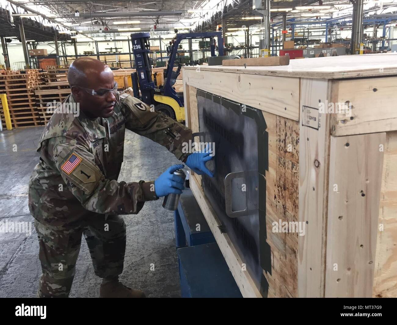 Sgt. Maj. Marvin Jones, RIA-JMTC sergeant major, sprays the first ...