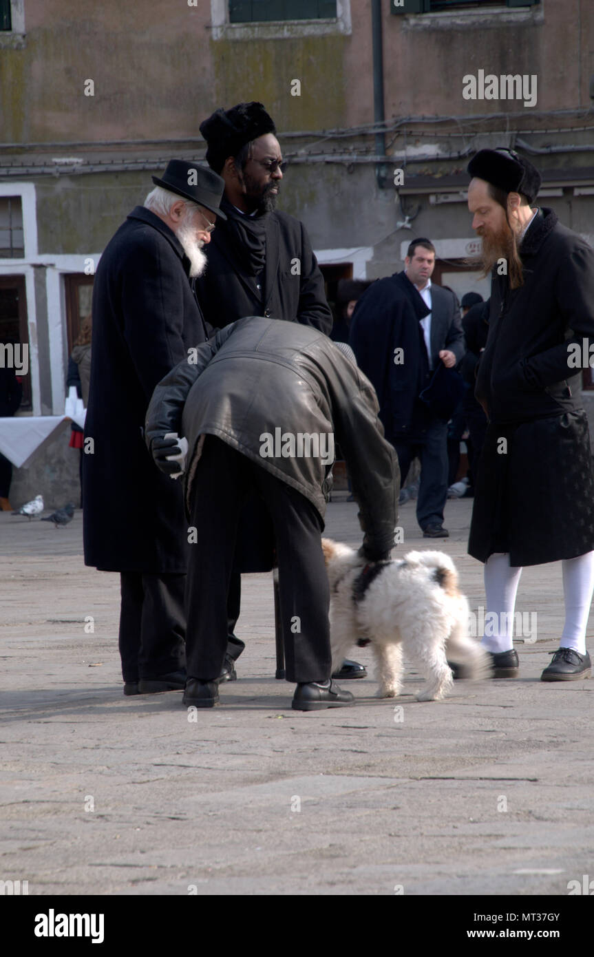 Group of Jewish men and dog in the historical Venetian Ghetto Stock ...