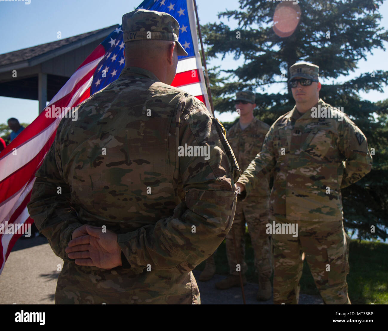 Sgt. Major Benjamin Joy leads a formation while Capt. Matthew Arnold ...