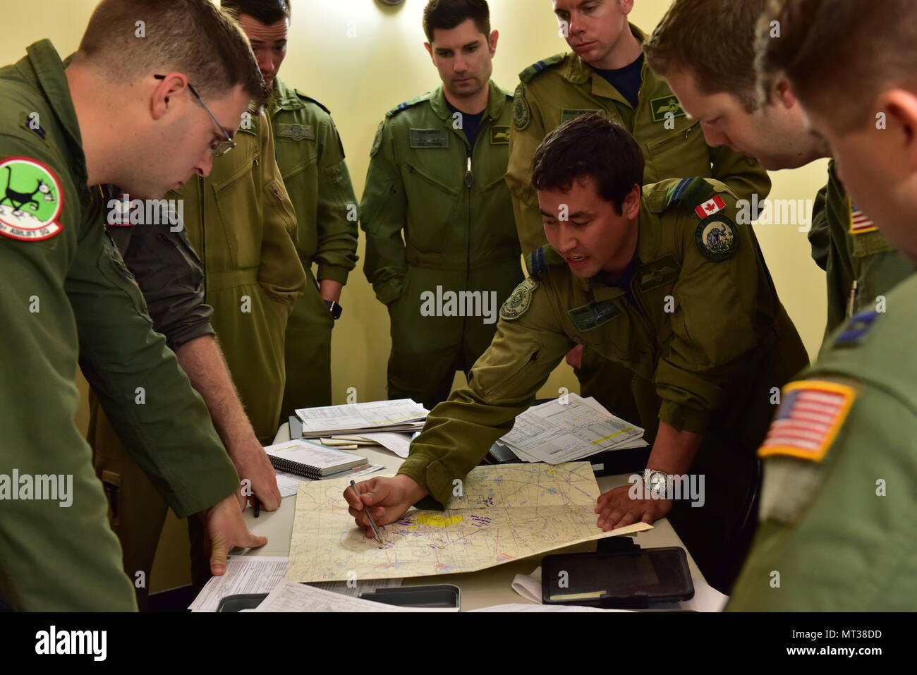 Royal Canadian air force pilot Capt. Daniel Ebisuzaki briefs 41st and ...