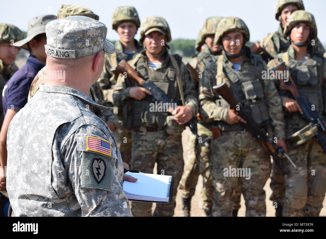 Capt. Kenneth Lorang, Training and Doctrine Command liaison officer to U.S. Army Central, takes ...