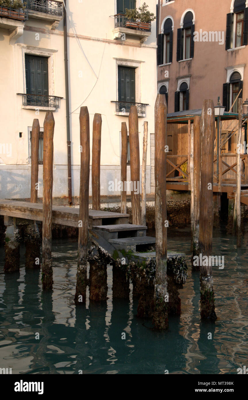 Wooden poled and water-bus stop near La Fenice on the Grand Canal ...