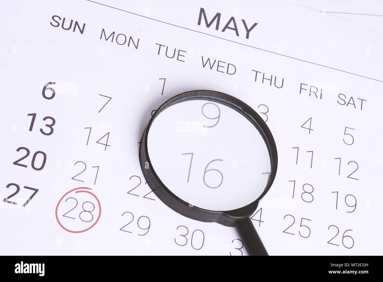 Magnifying calendar hi-res stock photography and images - Alamy