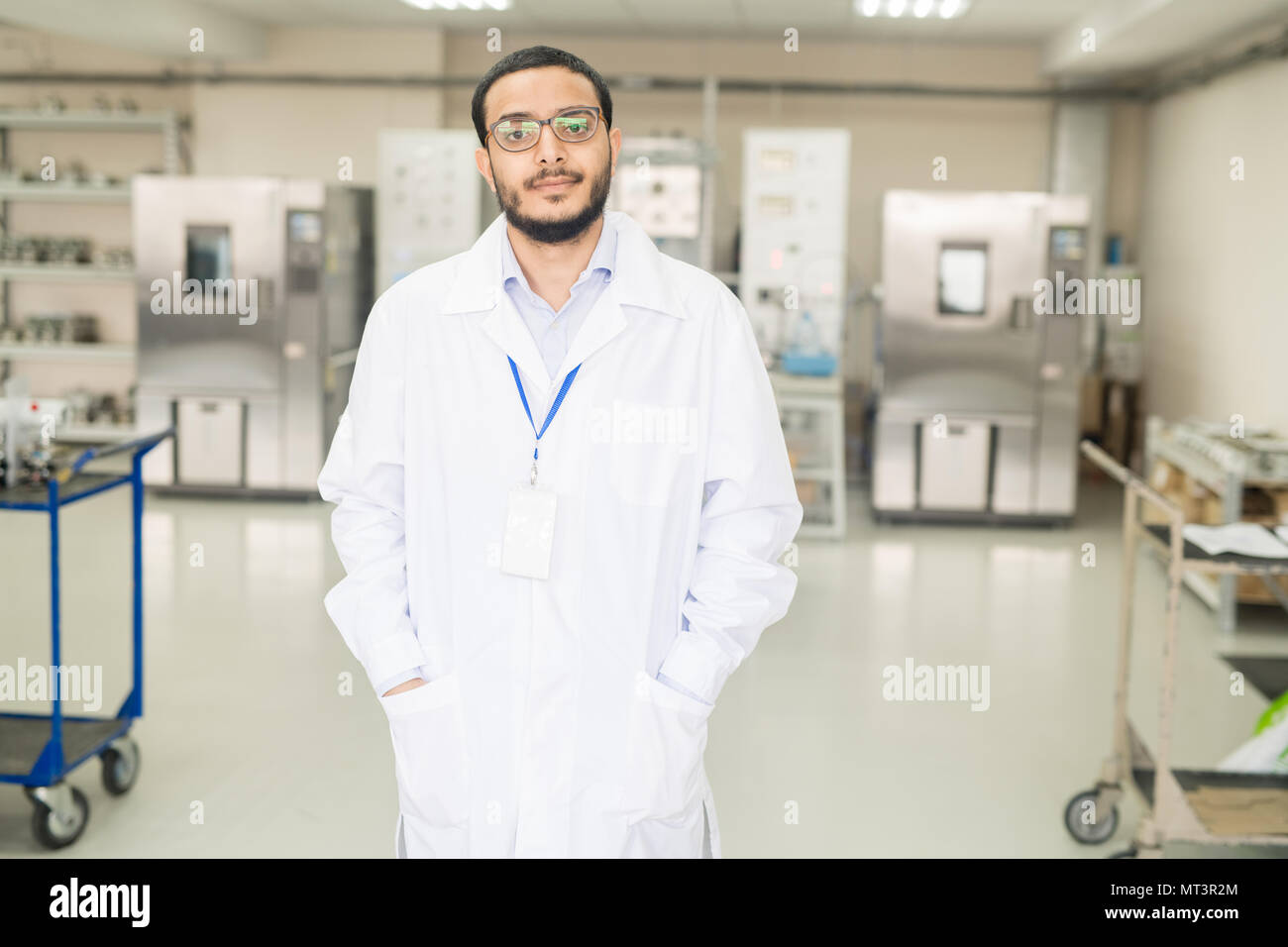 Confident Arabian engineer working in innovative plant Stock Photo - Alamy