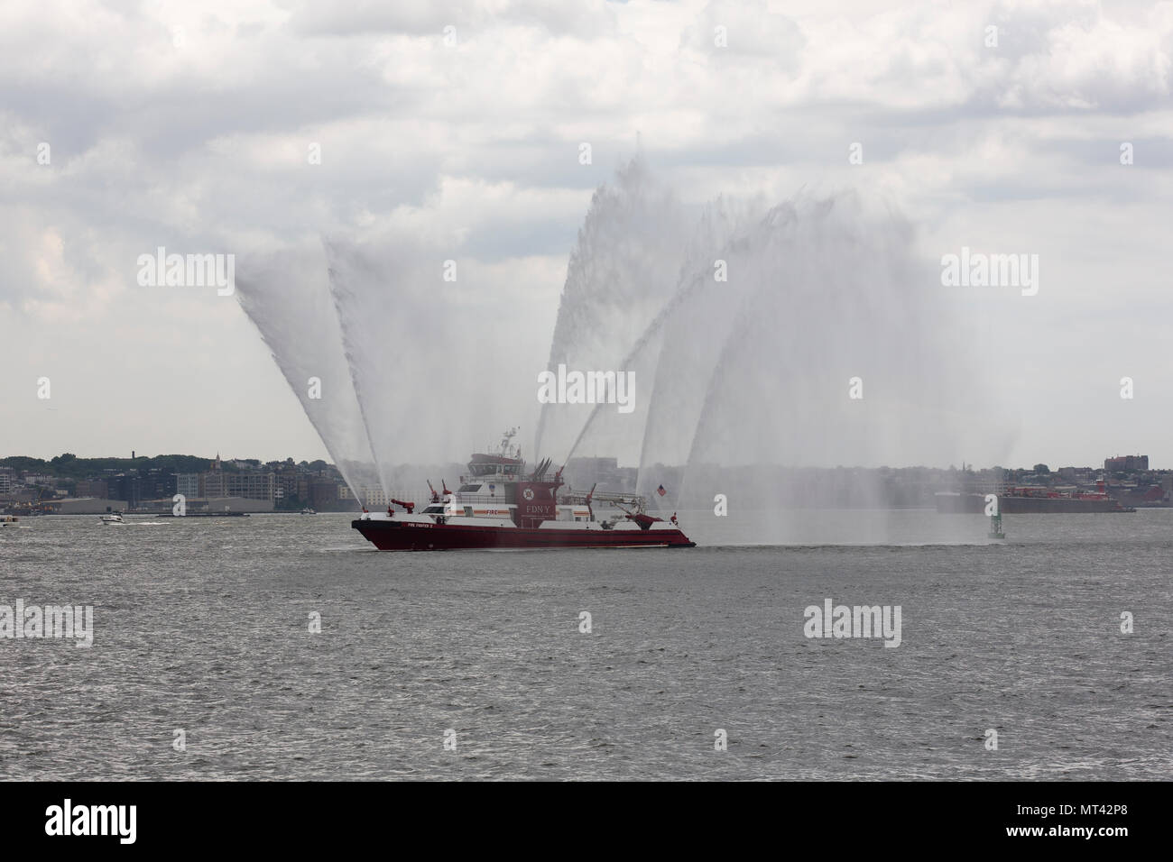 The Fire Fighter II, a fireboat in New York City, sprays water in New ...