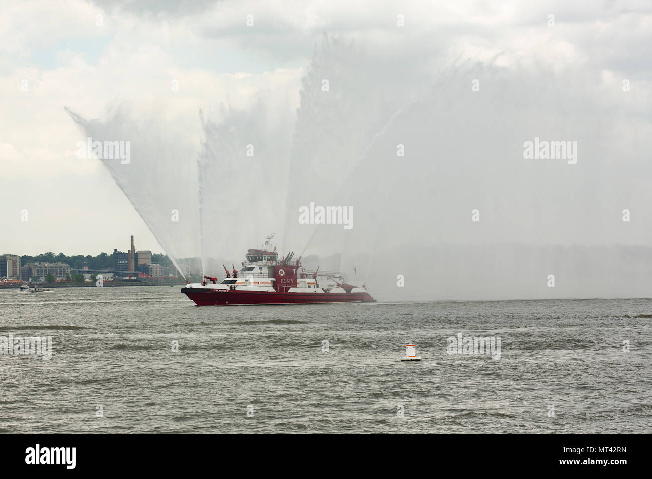 The Fire Fighter II, a fireboat in New York City, sprays water in New ...