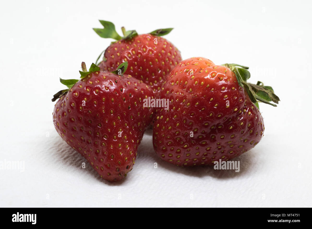 View of Three Strawberries Stock Photo - Alamy