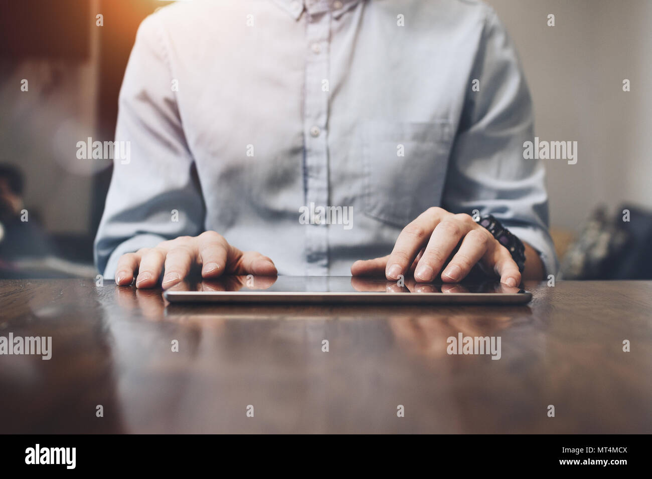 Closeup photo of male hands touching screen tablet. Modern tablet on ...