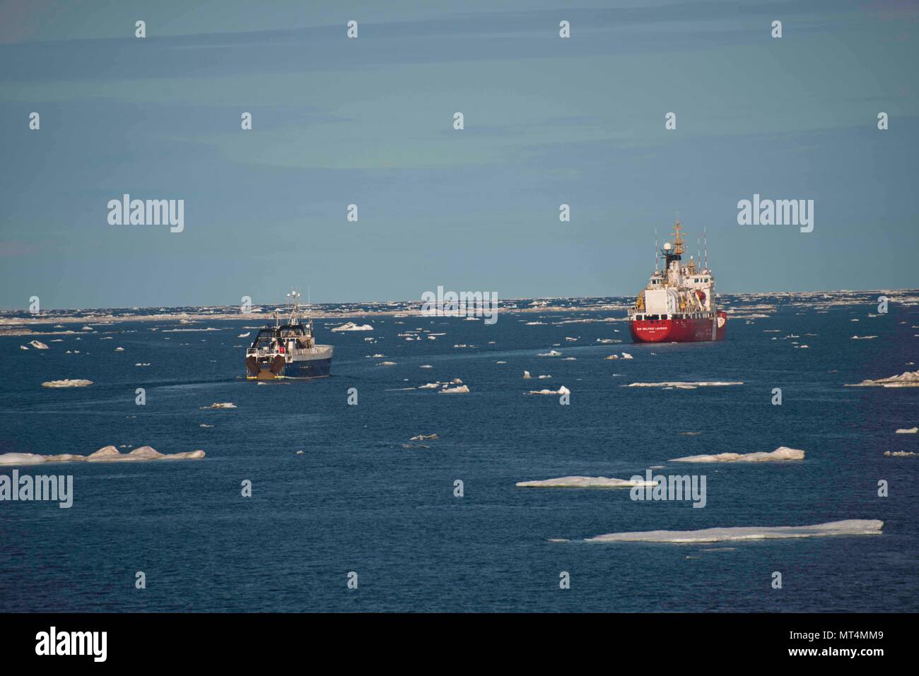 The crews of Canadian Coast Guard ice breaker Sir Wilfrid Laurier ...