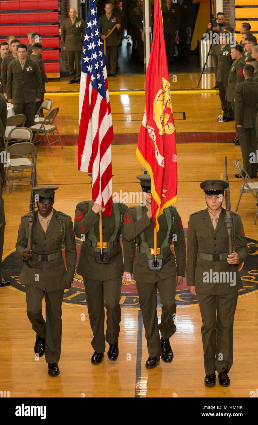U.S. Marines with 1st Battalion, 6th Marine Regiment present the colors ...
