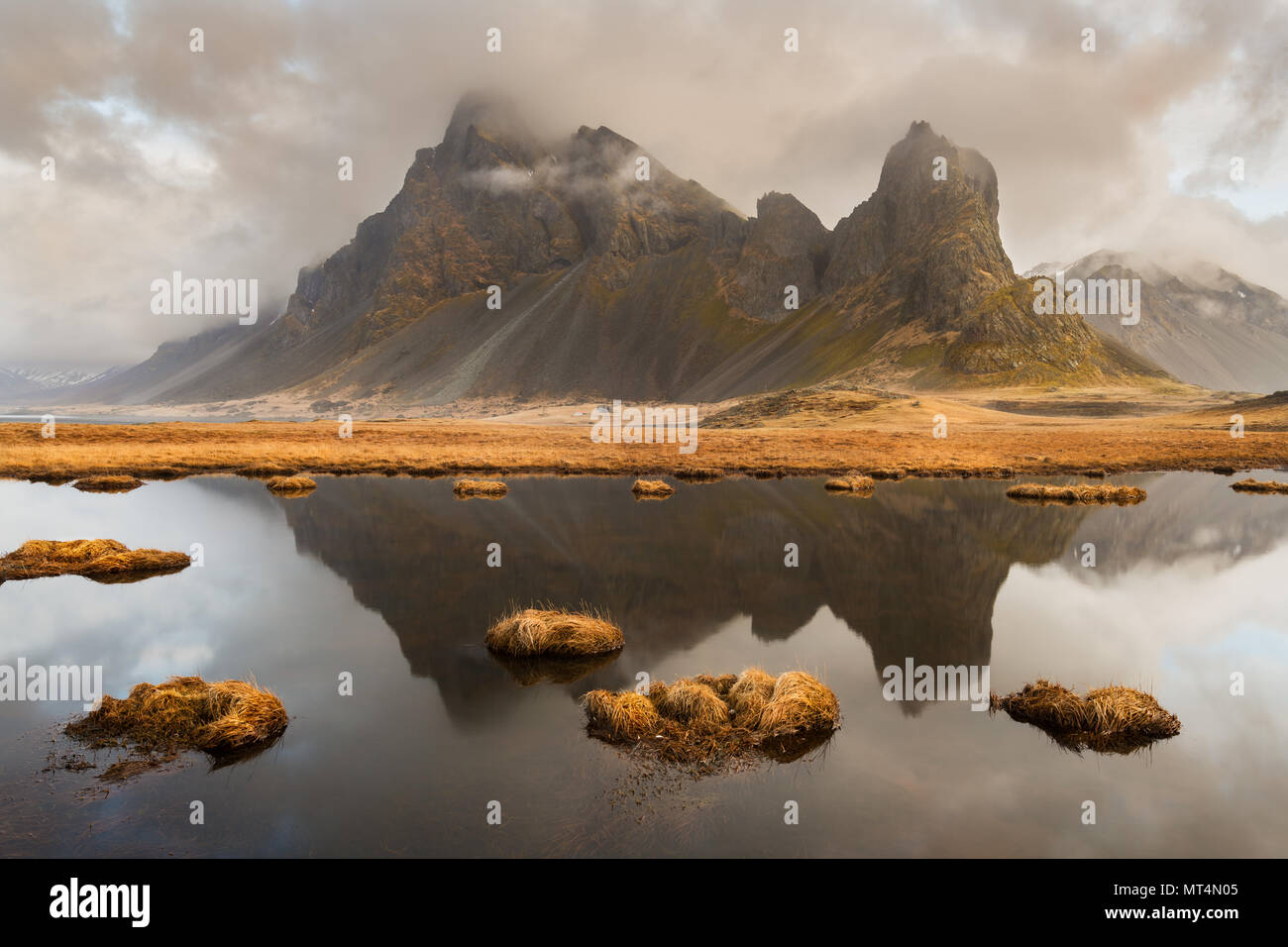 Morning reflections of Eystrahorn and Krossanesfjall Stock Photo - Alamy