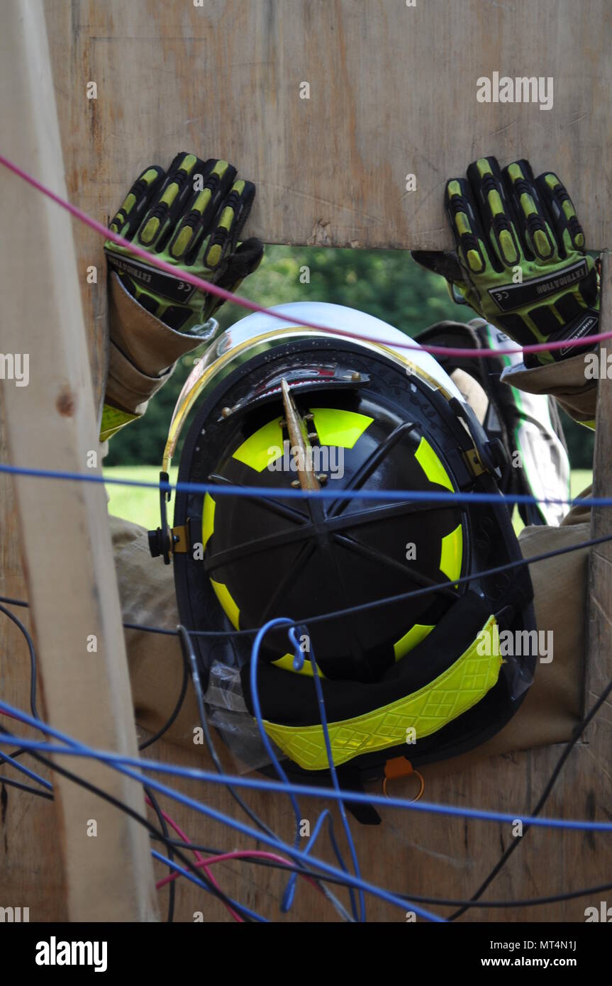 A Soldier from the 802nd Ordnance Co. enters a firefighting training ...