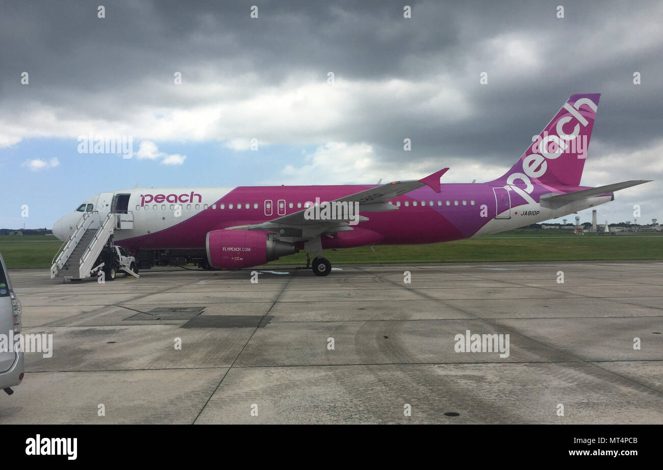 A Peach Aviation Airbus A320 passenger plane receives fuel from the ...