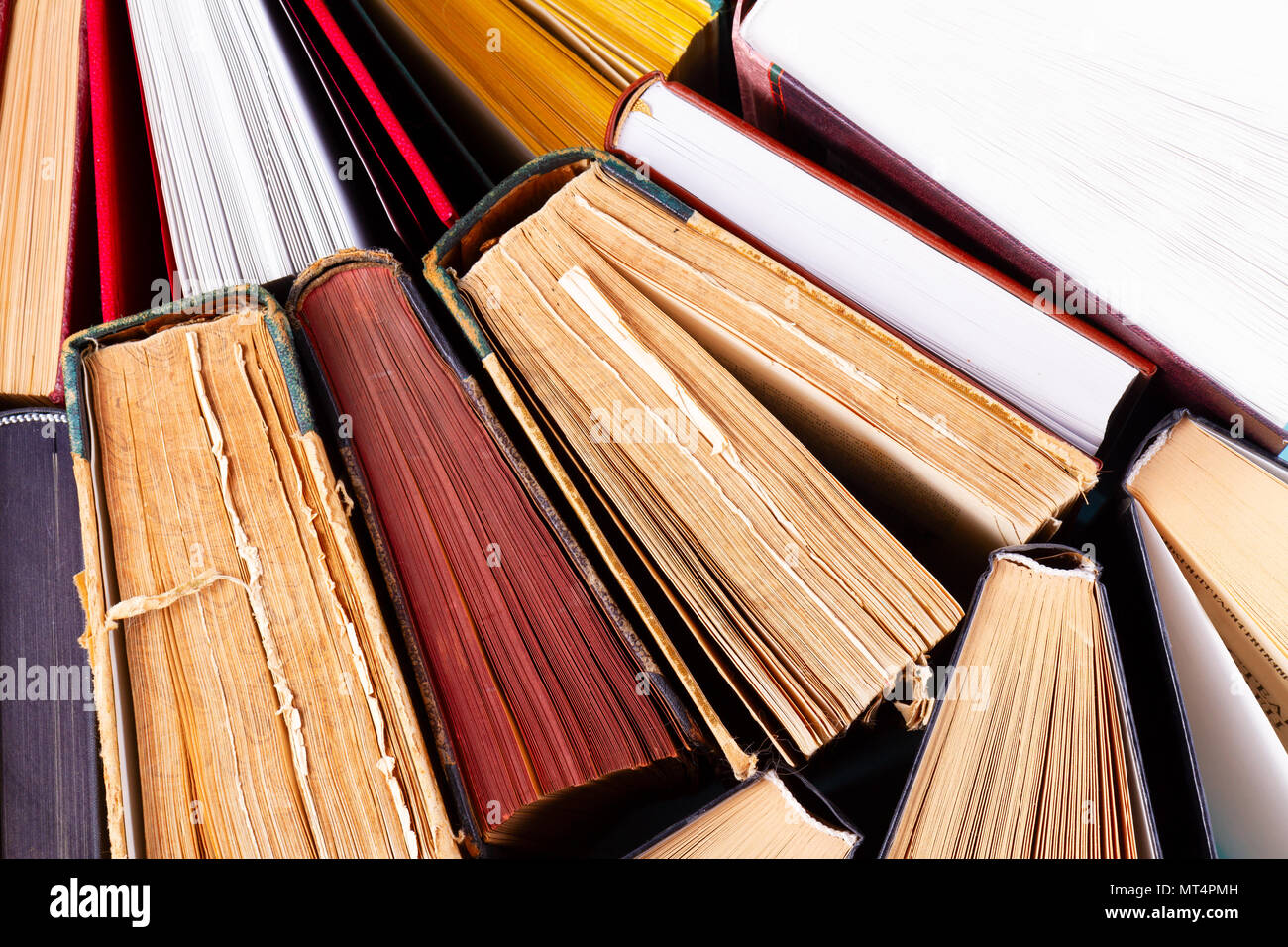 Pile of old books, close up top view bckground Stock Photo - Alamy