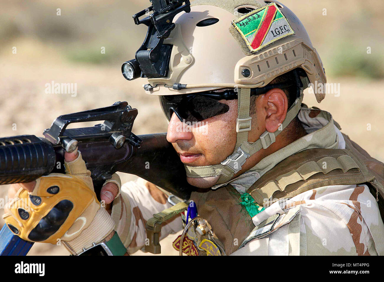 An Iraqi army soldier aims down the sights of his M16 rifle during ...