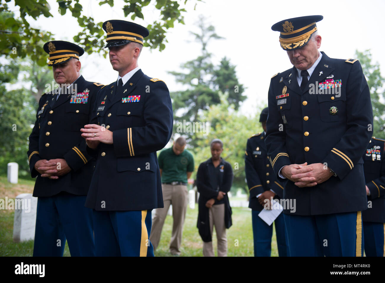 Chaplains bow their heads during at prayer at the 242nd U.S. Army ...