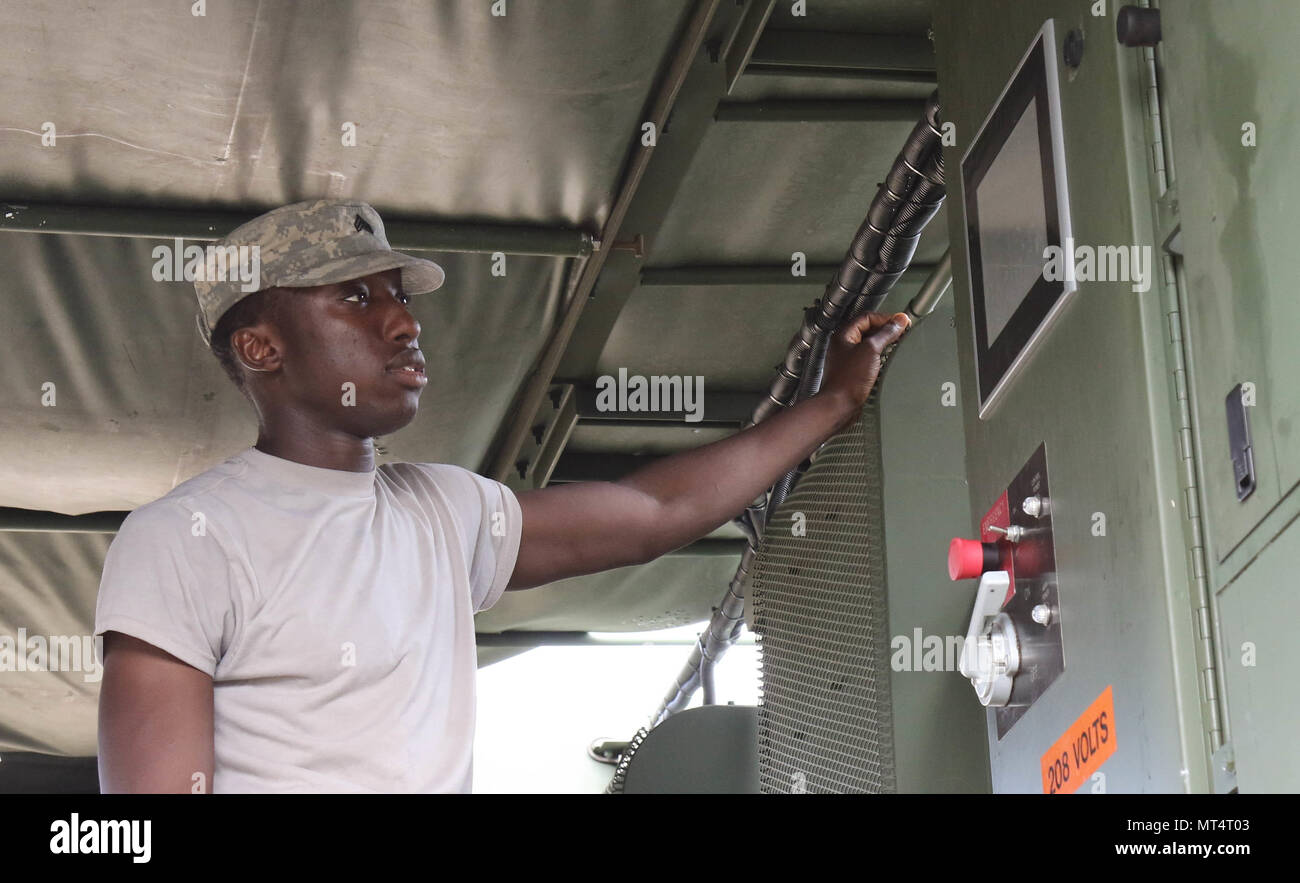 U.S. Army Reserve Sgt. Michael Jatta, a shower/laundry and clothing ...