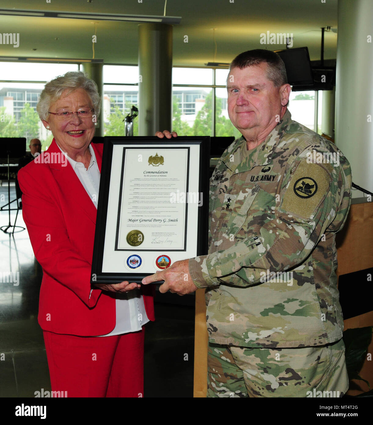 Alabama Gov. Kay Ivey presents Maj. Gen. Perry G. Smith a commendation ...