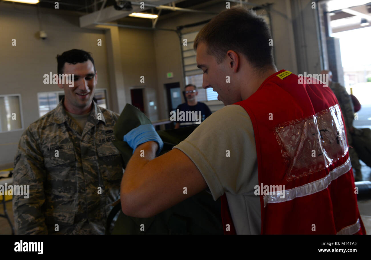 Airman 1st Class Michael Marrino, a line delivery crew member assigned ...