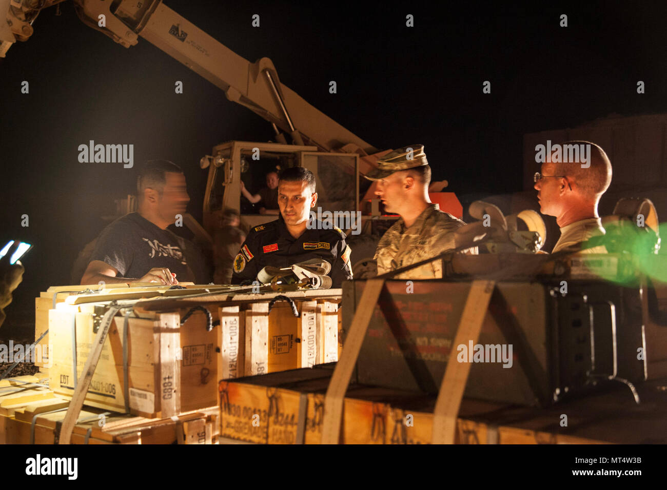 A member of the Iraqi Counter Terrorism Service works alongside U.S ...