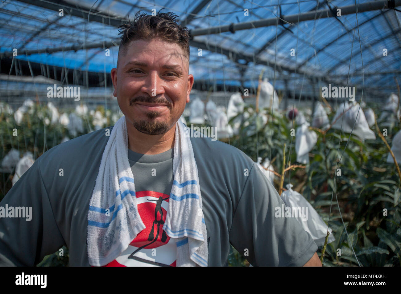 Mike A. Miranda, also known as Mango Mike, stands in one of his ...