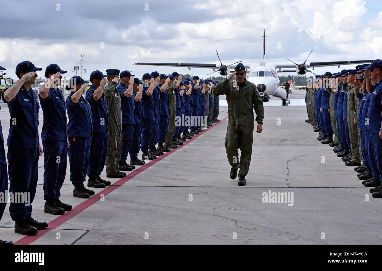 Coast Guard Capt. Todd W. Lutes salutes the crew of Coast Guard Air ...