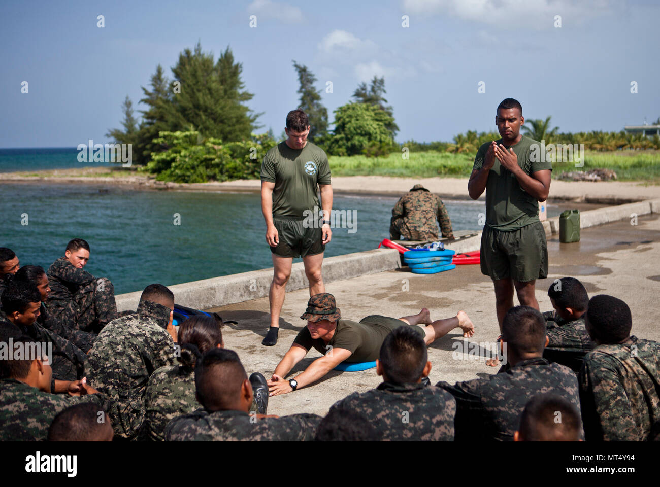 U.S. Marine Sgt. David G. Gaudette II, left, the detachment staff ...