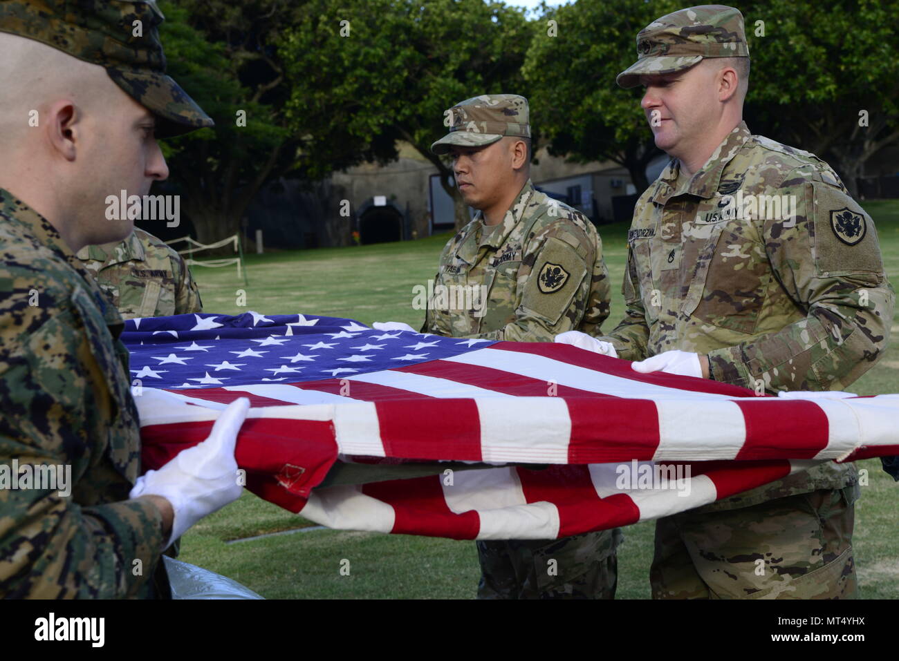Defense POW/MIA Accounting Agency (DPAA) personnel prepare to load a ...