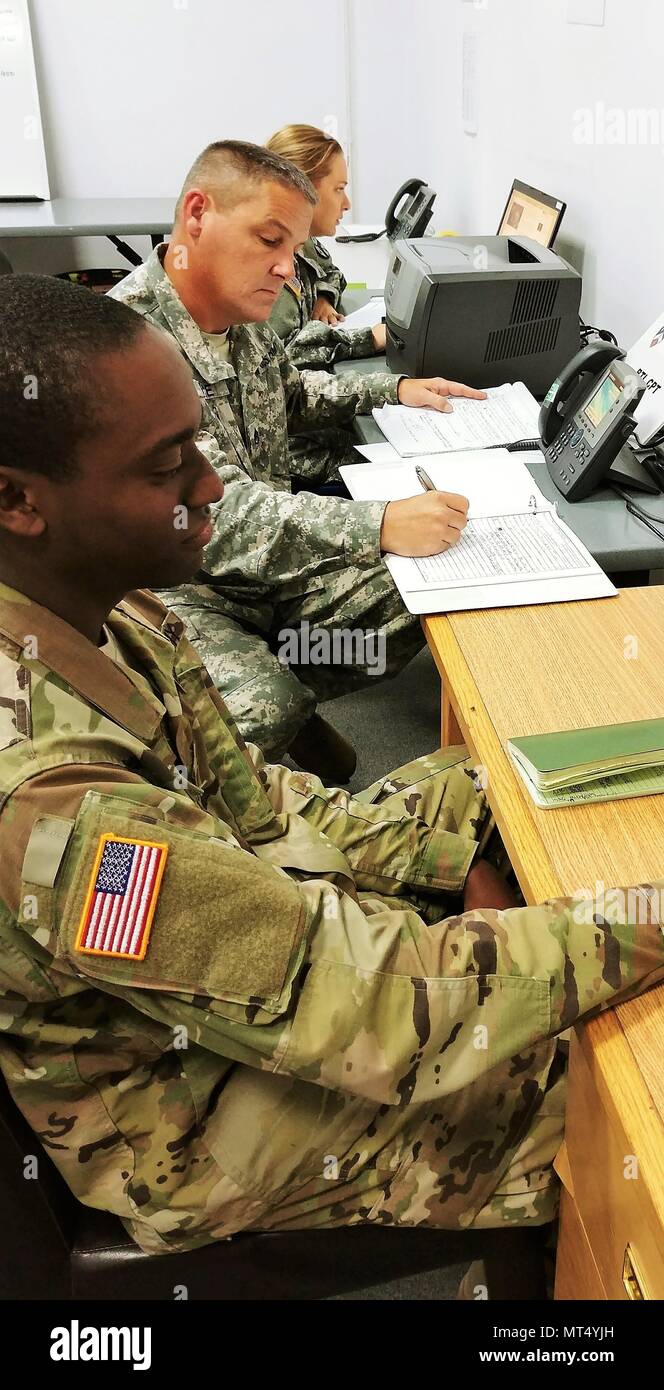 (From left) 2nd Lt. James Mitchell III, a human resources officer ...